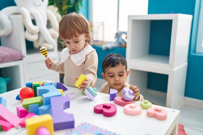Two Kids Playing with Construction Blocks Standing at Kindergarten ...