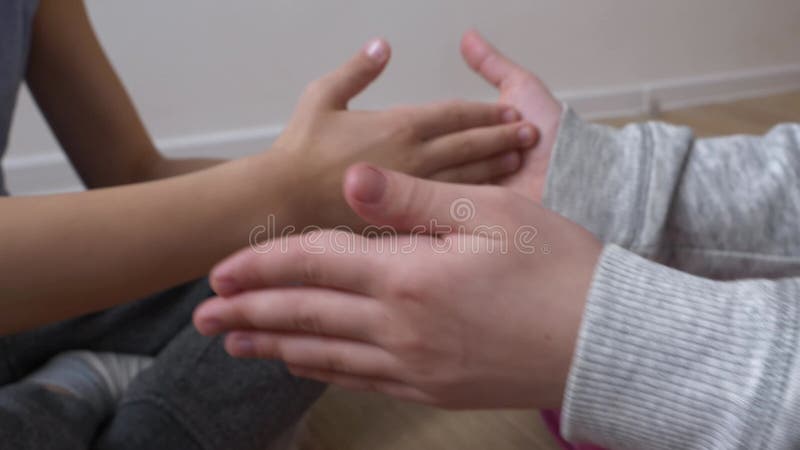 Two Kids Playing a Hand Palms Clapping Game in the Room, a Close-up ...