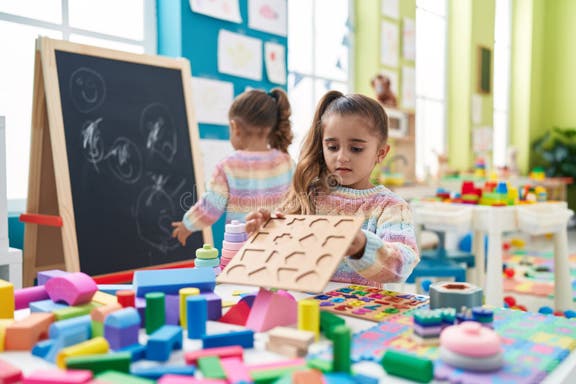Two Kids Playing with Maths Puzzle Game Standing at Kindergarten Stock ...