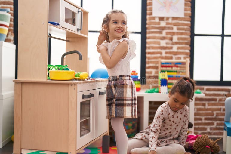 Two Kids Playing with Play Kitchen Standing at Kindergarten Stock Photo ...