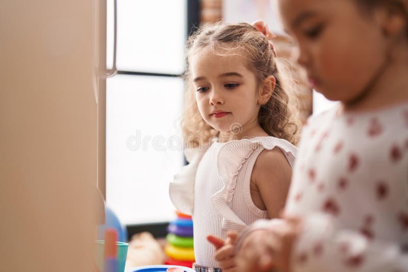 Two Kids Playing with Play Kitchen Standing at Kindergarten Stock Image ...