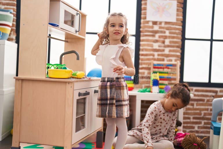Two Kids Playing with Play Kitchen Standing at Kindergarten Stock Photo ...
