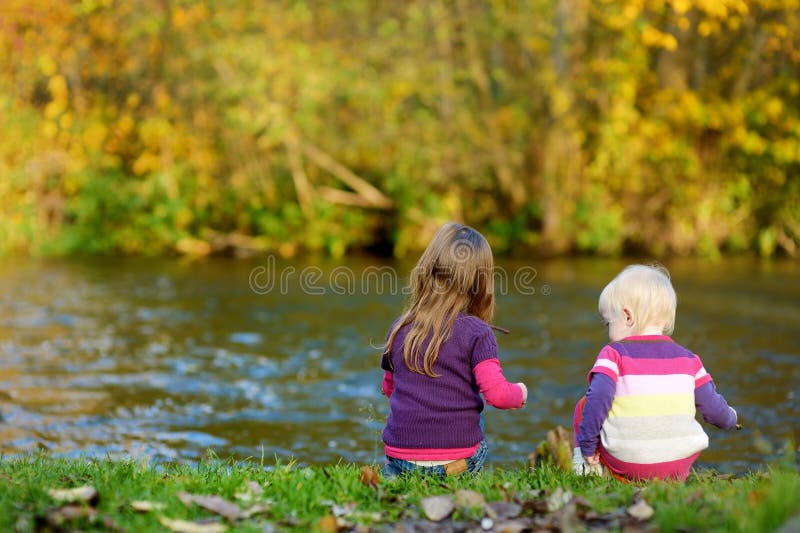 Two Kids Playing by a River Stock Image - Image of preschool, caucasian ...
