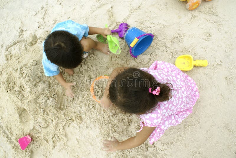 Two kids playing sand stock photo. Image of sandy, asian - 3099718