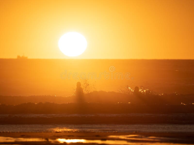Two Kids Playing in Water during the Sunset Stock Image - Image of ...