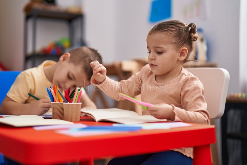 Two Kids Preschool Students Sitting on Table Drawing on Paper at ...