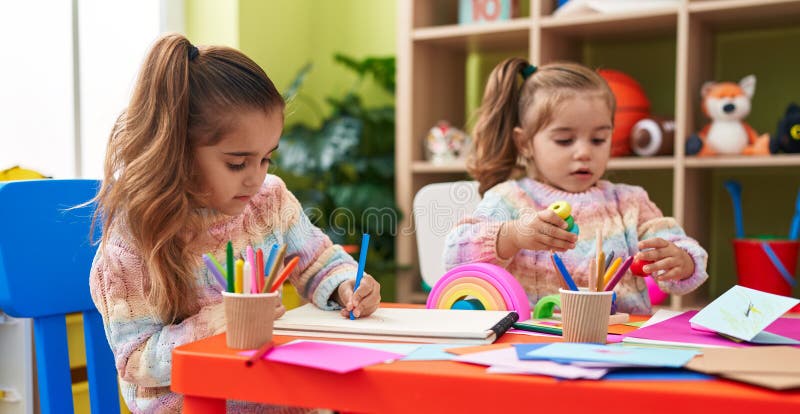 Two Kids Preschool Students Sitting on Table Drawing on Paper at ...