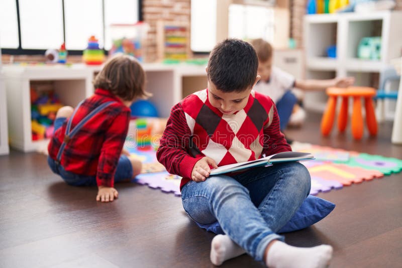 Two Kids Reading Book Sitting on Floor at Kindergarten Stock Image ...
