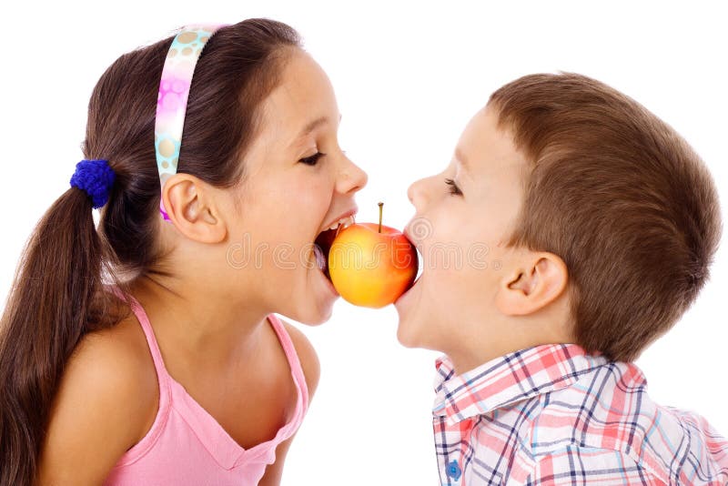 Two kids sharing the apple stock image. Image of little - 30602901