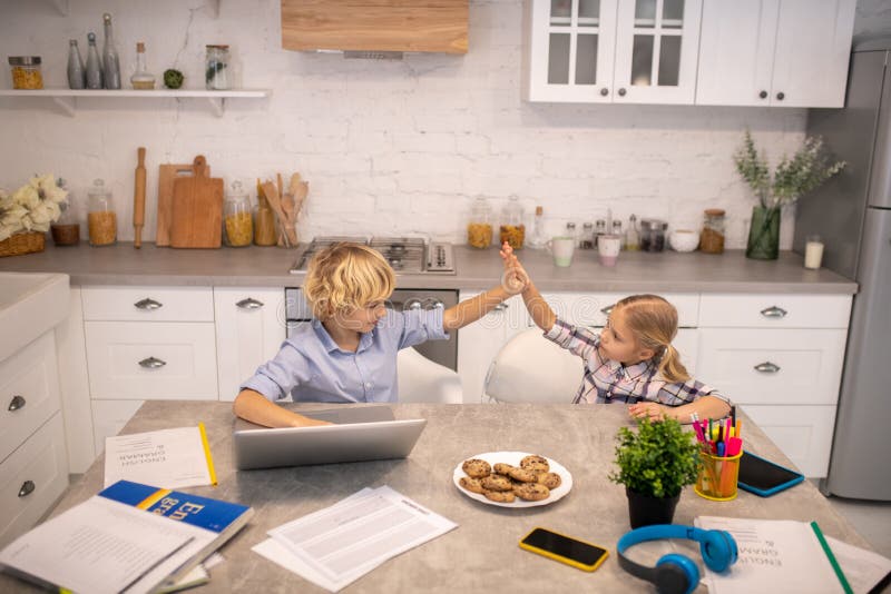 Two Kids Sitting at the Table and Feeling Great Stock Image - Image of ...