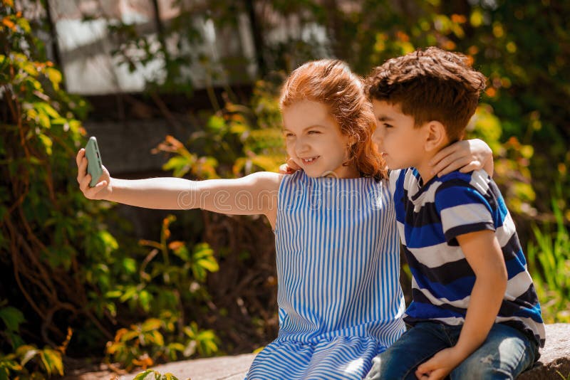 Two Kids Sitting Together and Making Selfie Stock Photo - Image of ...