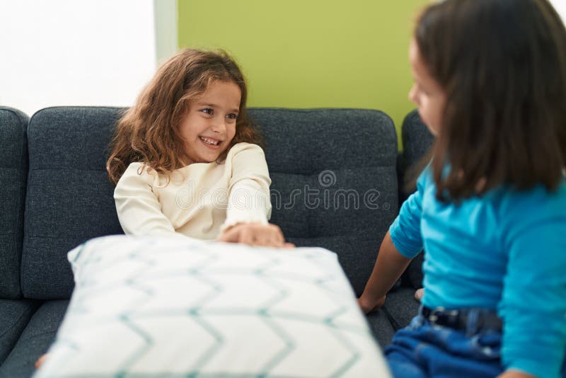 Two Kids Smiling Confident Sitting on Sofa Speaking at Home Stock Image ...