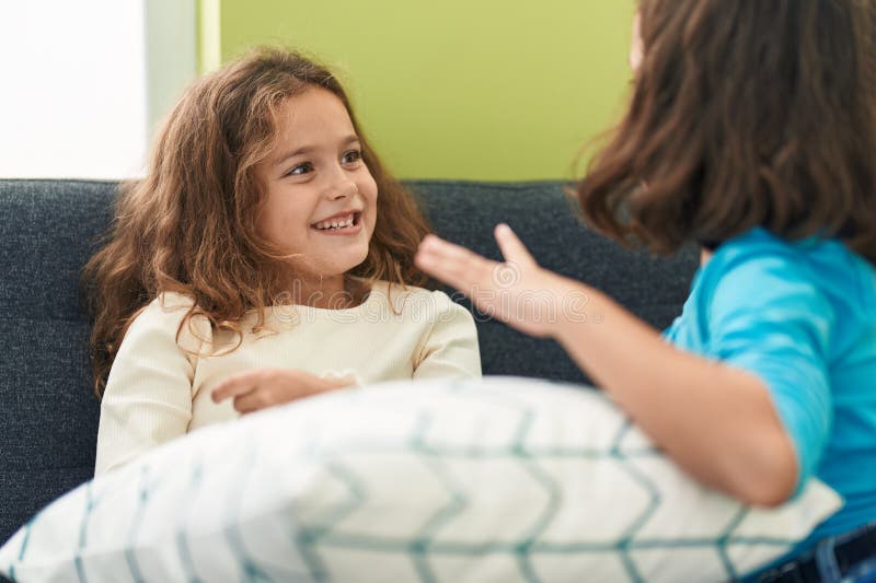 Two Kids Smiling Confident Sitting on Sofa Speaking at Home Stock Image ...