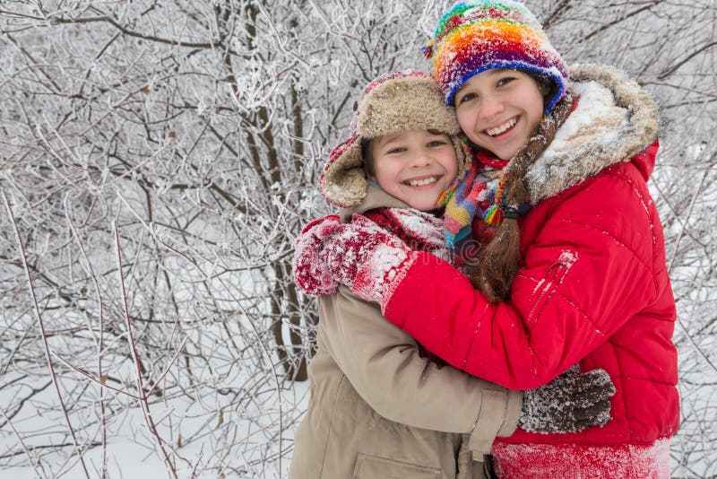 Two Kids Standing Together on Winter Forest Stock Photo - Image of ...