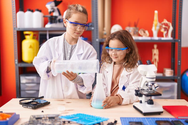 Two Kids Students Pouring Liquid on Test Tube at Laboratory Classroom ...