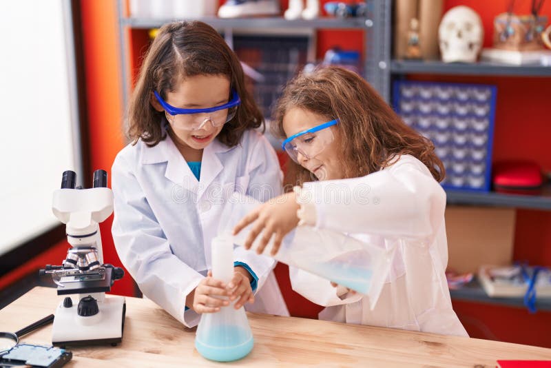 Two Kids Students Pouring Liquid on Test Tube at Laboratory Classroom ...