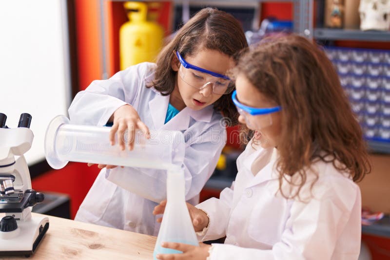 Two Kids Students Pouring Liquid on Test Tube at Laboratory Classroom ...