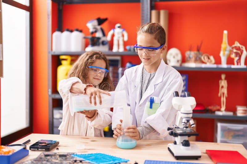 Two Kids Students Pouring Liquid on Test Tube at Laboratory Classroom ...