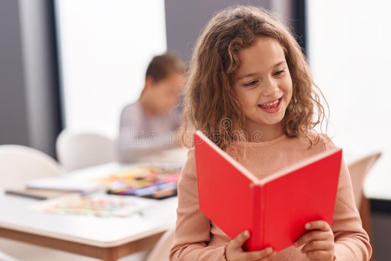 Two Kids Students Reading Book Studying at Classroom Stock Photo ...