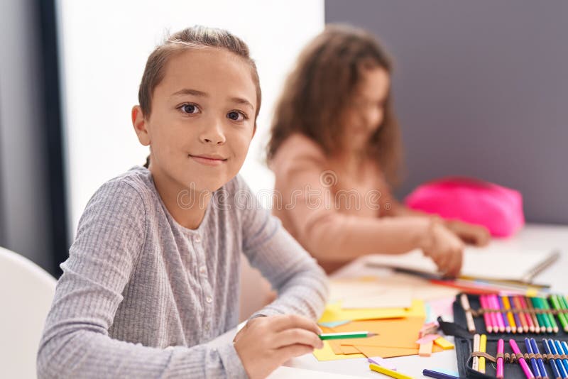 Two Kids Students Sitting on Table Drawing on Notebook Paper at ...