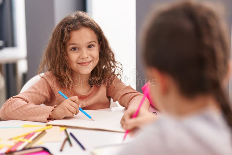 Two Kids Students Sitting on Table Drawing on Notebook Paper at ...