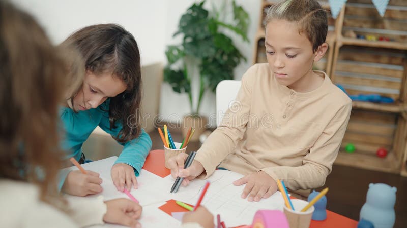 Two Kids Students Sitting on Table Drawing on Paper at Kindergarten ...