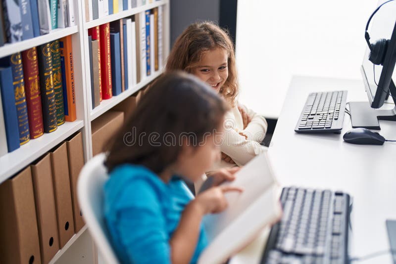 Two Kids Students Using Computer Reading Book at Classroom Stock Image ...