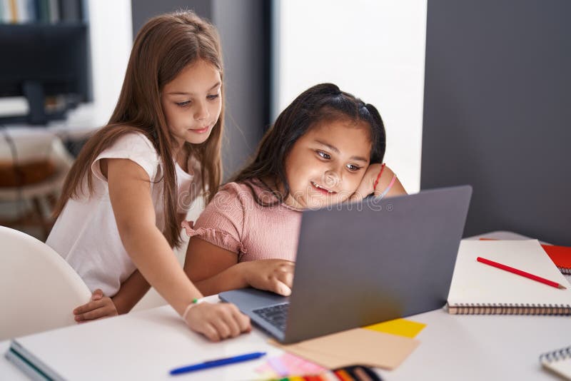 Two Kids Students Using Laptop Studying at Classroom Stock Photo ... Two Kids Students Using Laptop Studying at Classroom Stock Photo ...