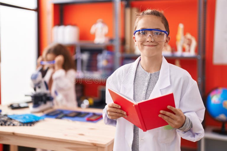 Two Kids Students Using Microscope Reading Notebook at Laboratory ...