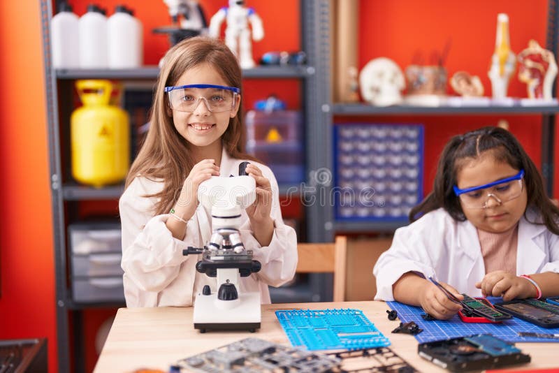 Two Kids Students Using Microscope Repairing Smartphone at Laboratory ...
