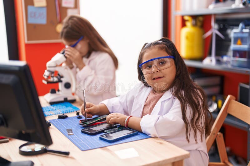 Two Kids Students Using Microscope Repairing Smartphone at Laboratory ...