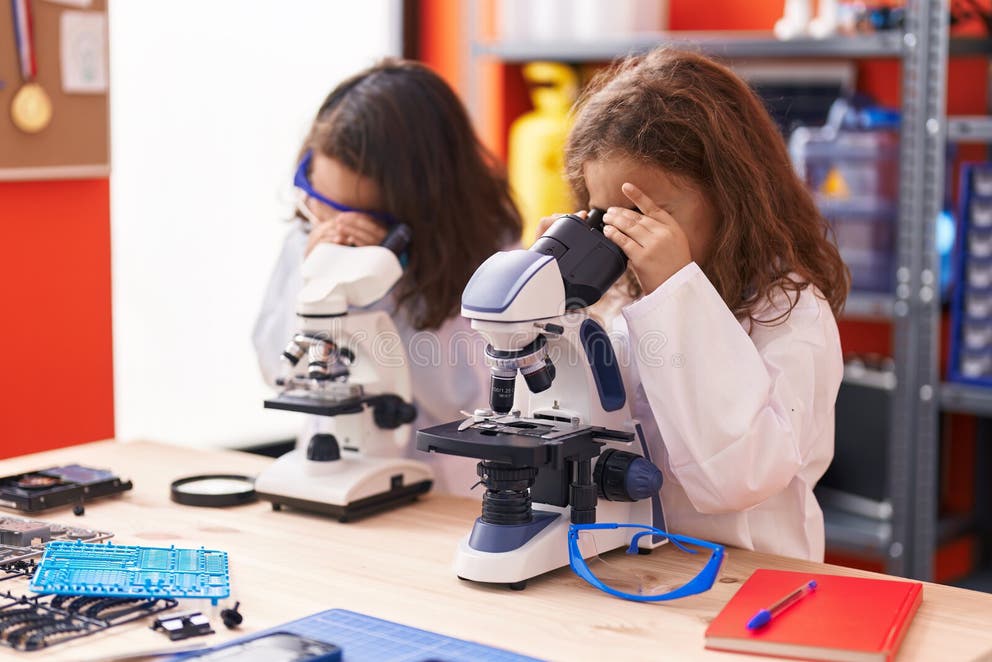Two Kids Students Using Microscopes Standing at Laboratory Classroom ...