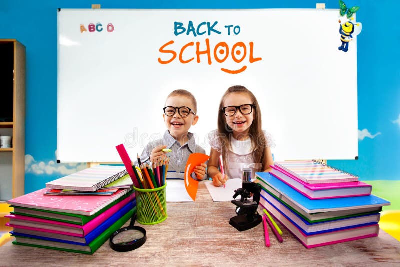 Two Kids at the Table in Classroom on Lesson Stock Photo - Image of ...