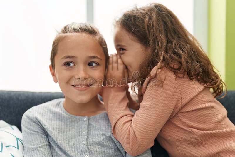 Two Kids Telling Secret Sitting on Sofa at Home Stock Image - Image of ...