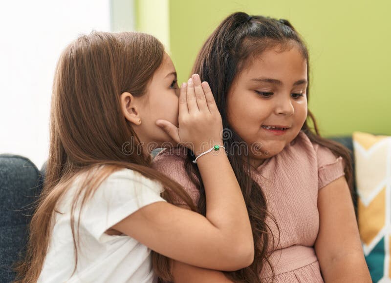 Two Kids Telling Secret Sitting on Sofa at Home Stock Photo - Image of ... Two Kids Telling Secret Sitting on Sofa at Home Stock Photo - Image of ...