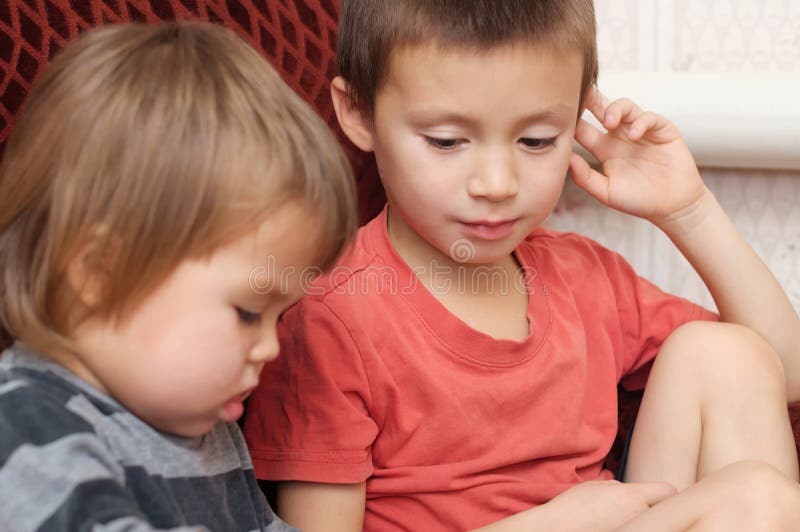 Two Kids Together Looking Book Stock Photo - Image of toddler, little ...