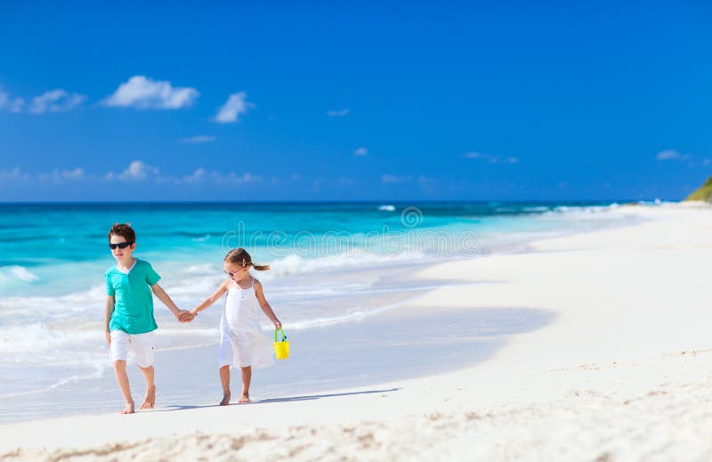 Two Kids Walking Along a Beach at Caribbean Stock Image - Image of ...
