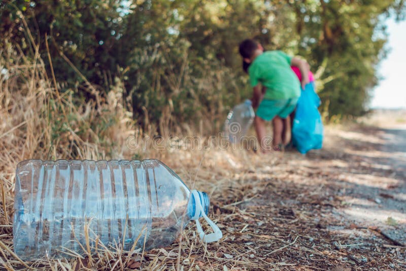 Two Kind Children Doing School Tasks and Collecting Garbage with a ...