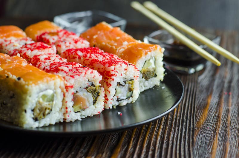 Two Types of Sushi Rolls with Flying Fish Roe Stock Photo - Image of ...