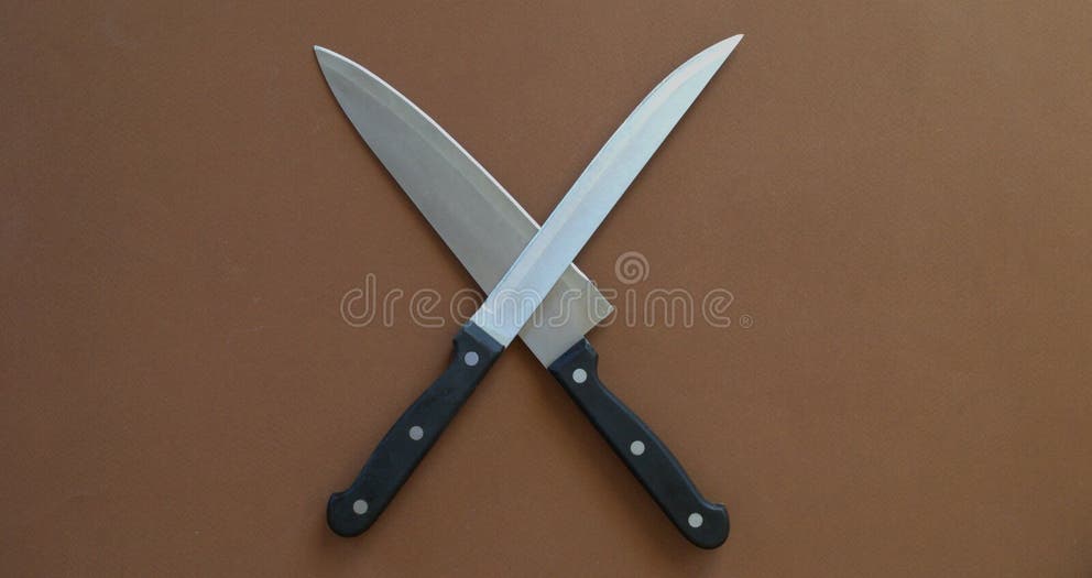 Two kitchen knives stock image. Image of knives, hand - 224410643