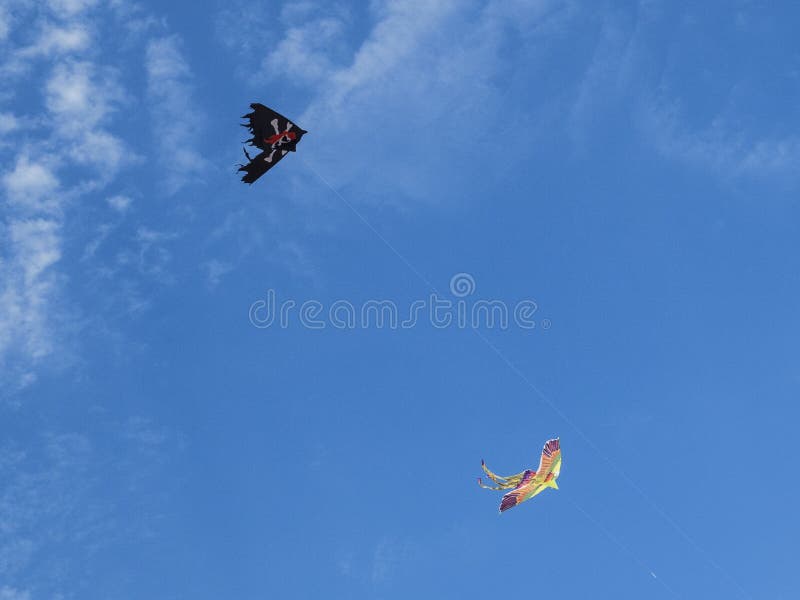 Two Colored Kites in the Sky with White Clouds Stock Image - Image of ...
