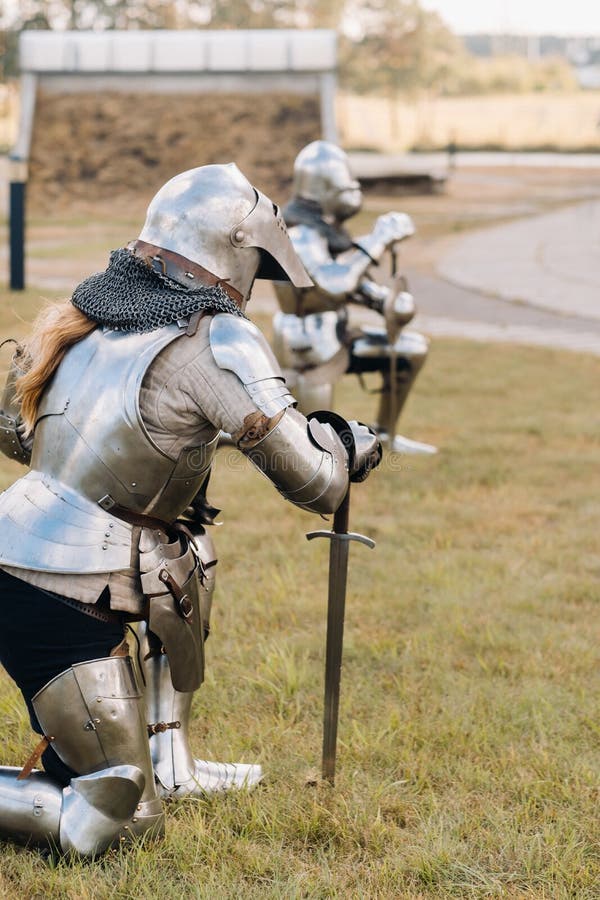 Two Knights in Ancient Metal Armor Stand at the Stone Wall of the ...