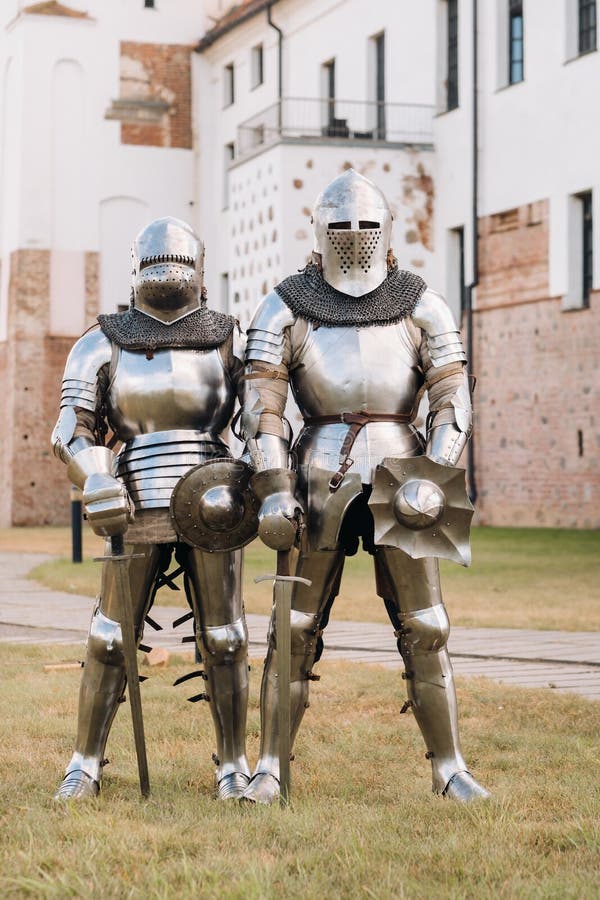 Two Knights in Ancient Metal Armor Stand at the Stone Wall of the ...