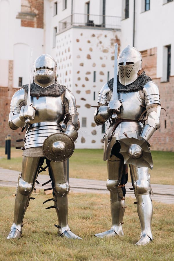 Two Knights in Ancient Metal Armor Stand at the Stone Wall of the ...