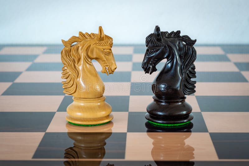 Two Knights Face Each Other in a Game of Chess Stock Image - Image of ...