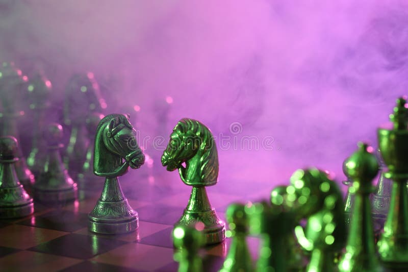 Two Knights and Other Chess Pieces on Checkerboard in Color Light ...