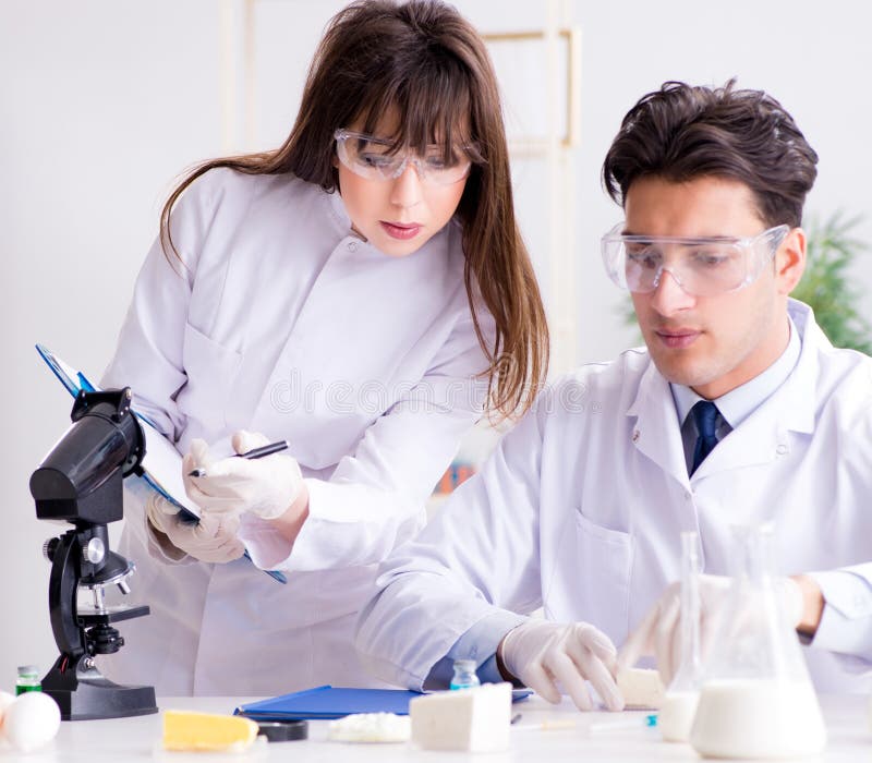 Two Lab Doctor Testing Food Products Stock Photo - Image of microscope ...