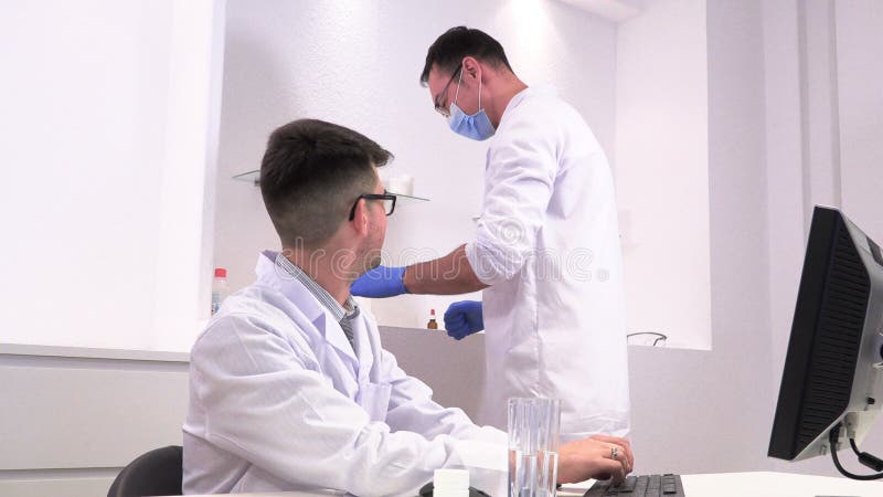 Two Lab Workers Research Microbiology and Chemistry with ...