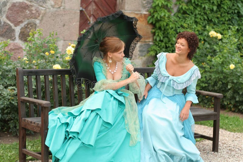 Two ladies stock photo. Image of decor, bench, costume - 3742472