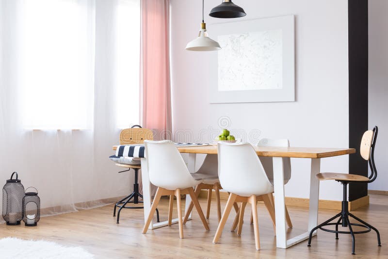 Two Lamps Hanging Over Table Stock Image - Image of black, accessories ...